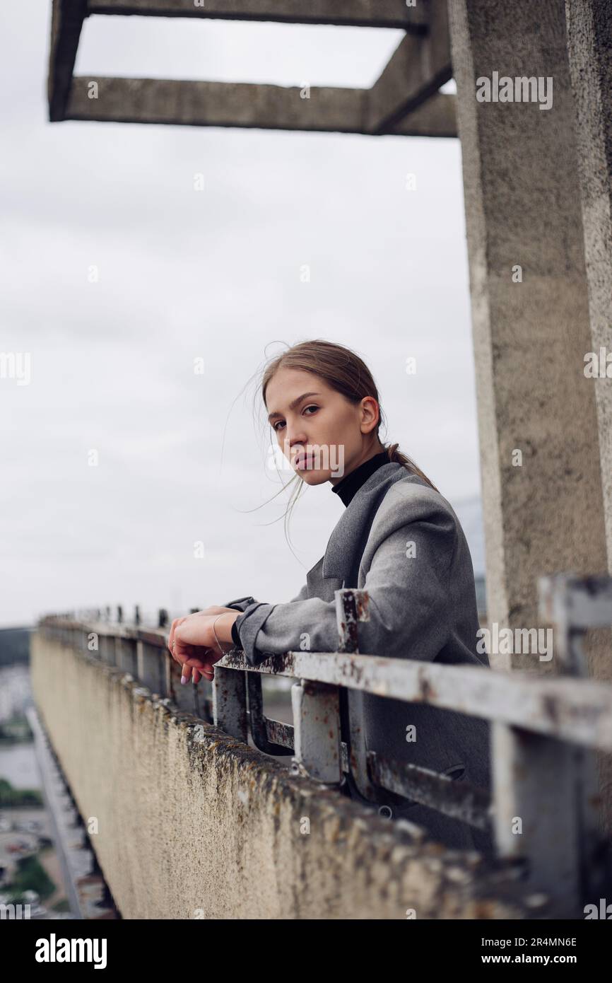 Building roof woman hi-res stock photography and images - Alamy
