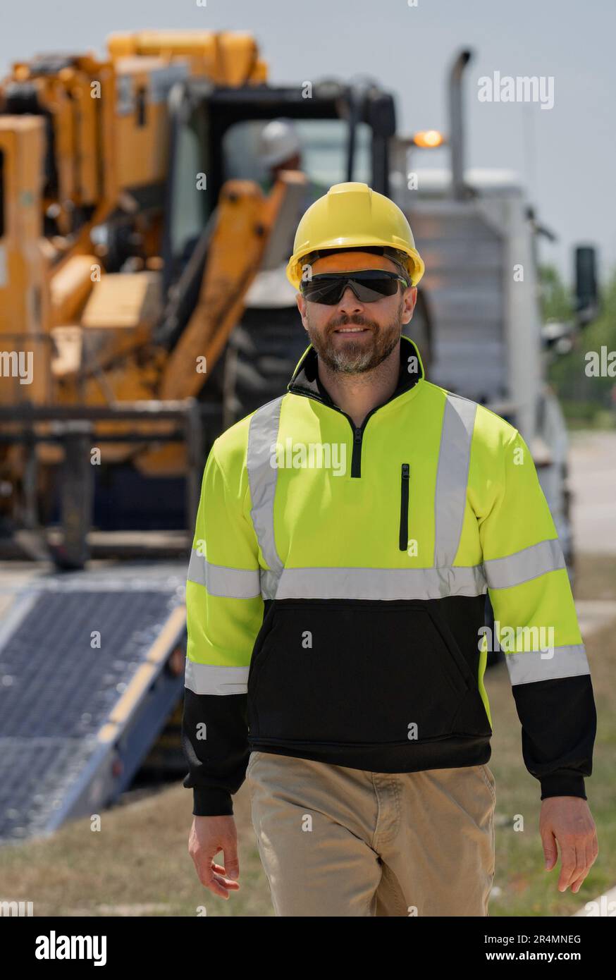 Machinery builder at buildings background. Excavator loader tractor and ...