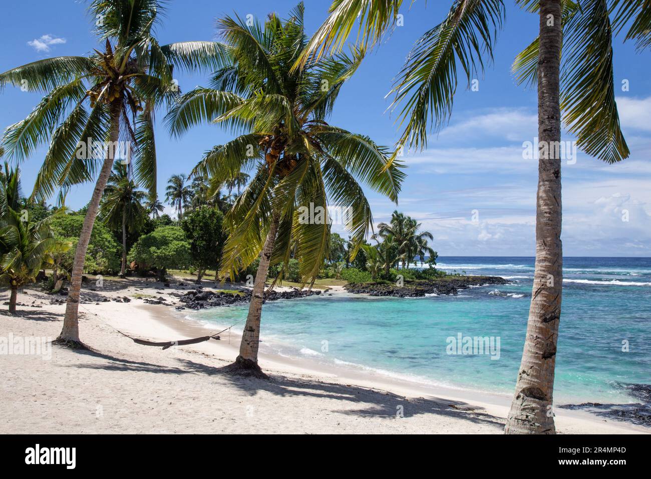 Palm trees and hammock at white sand beach, Matareva, Samoa Stock Photo ...