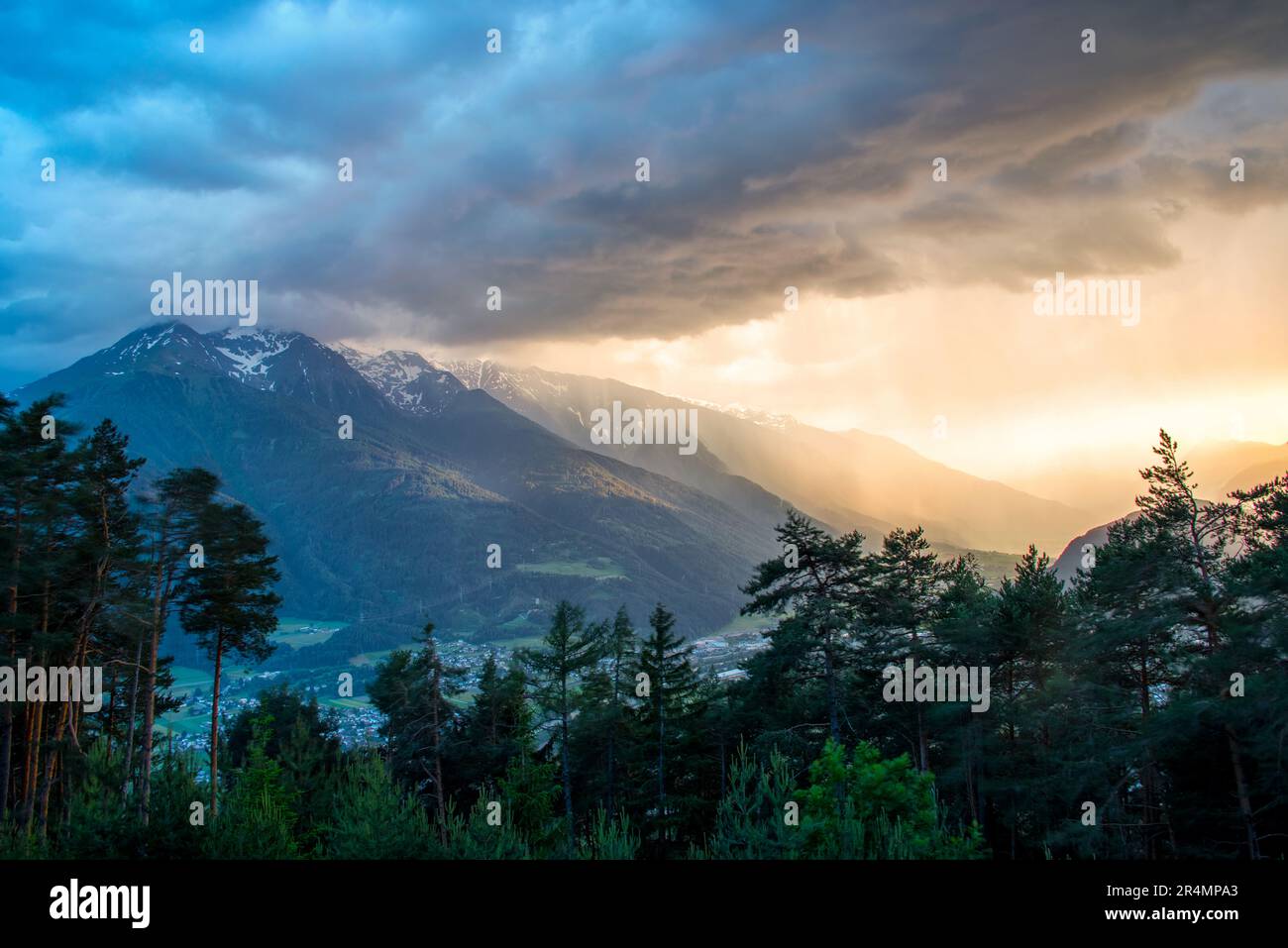 Austrian mountains and valley in mysterious light Stock Photo - Alamy