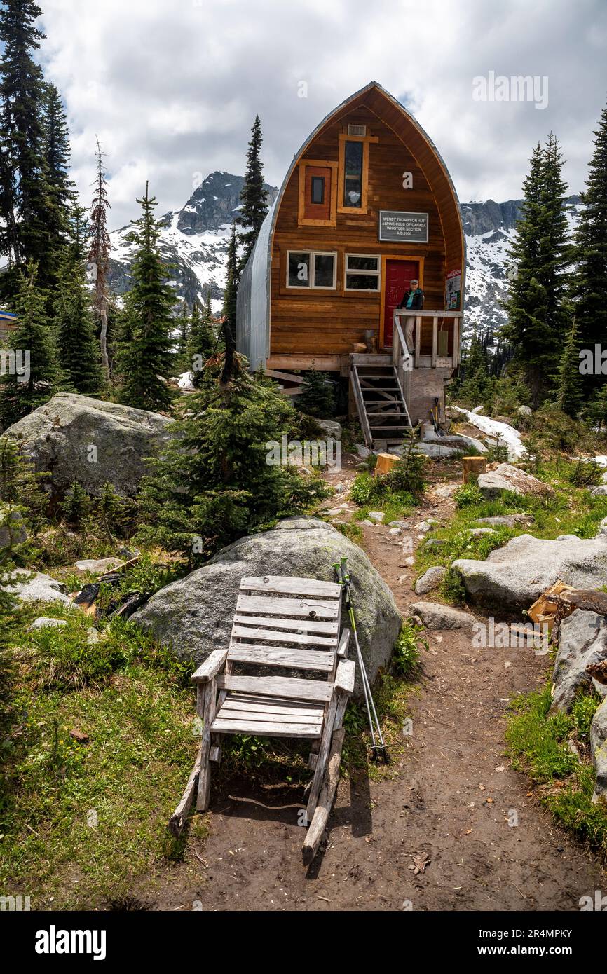 Full length of women hanging out at mountain cabin in British Columbia ...