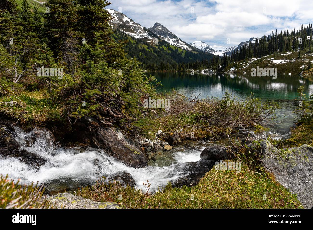 Scenic view of an alpine lake in mountains with blue sky in Canada ...