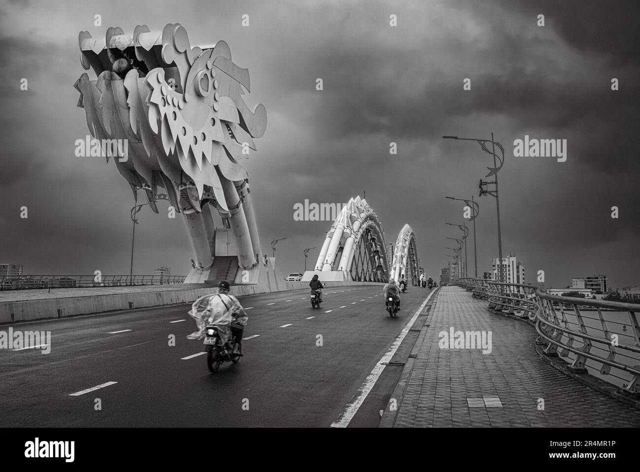 The Dragon Bridge in the rain in Danang, Vietnam. The bridge puts on a ...