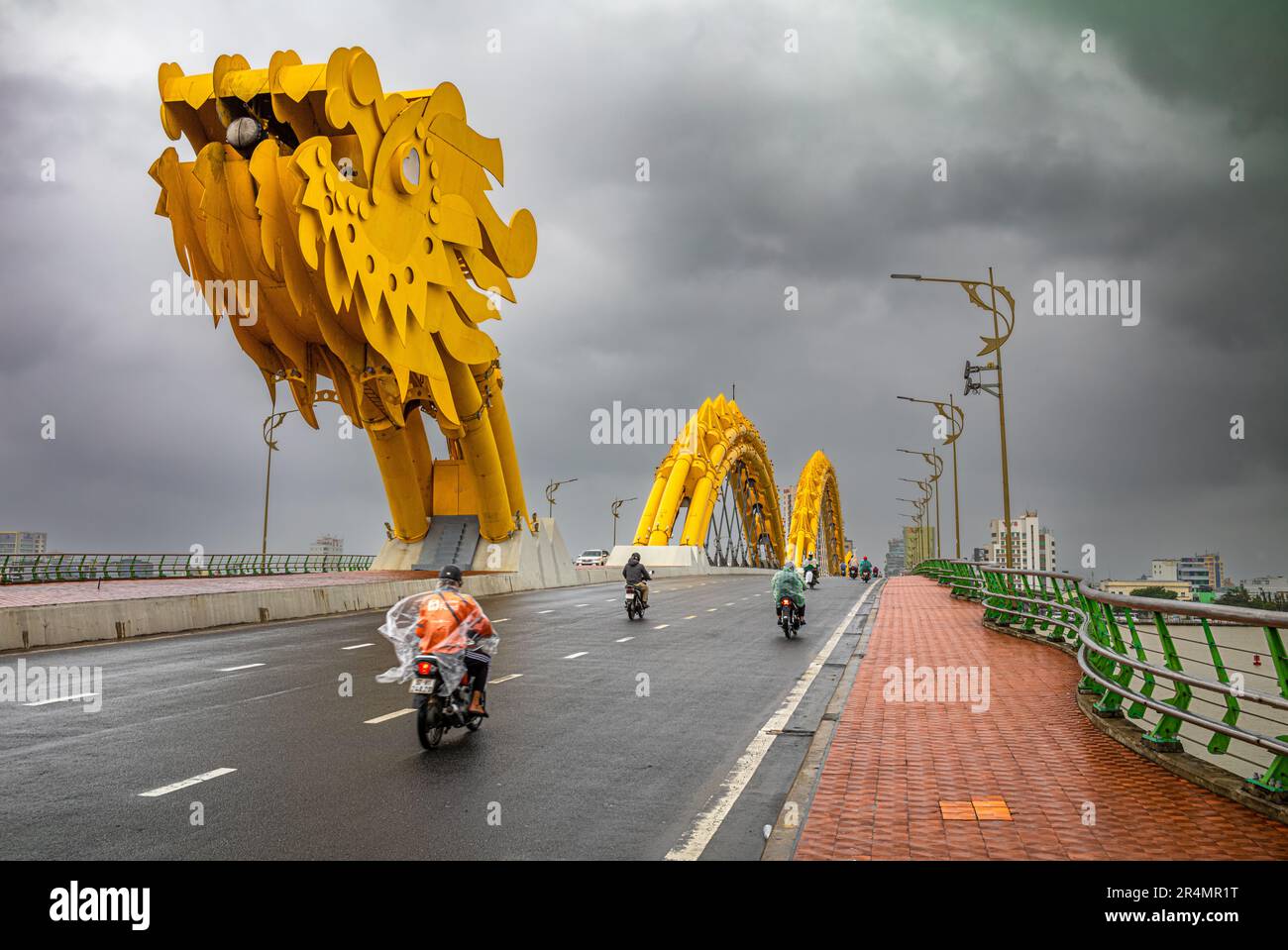 The Dragon Bridge in the rain in Danang, Vietnam. The bridge puts on a ...