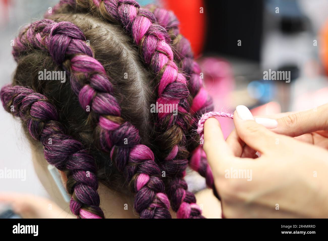 Braid the pigtails into a ponytail and an afro-tail Stock Photo - Alamy