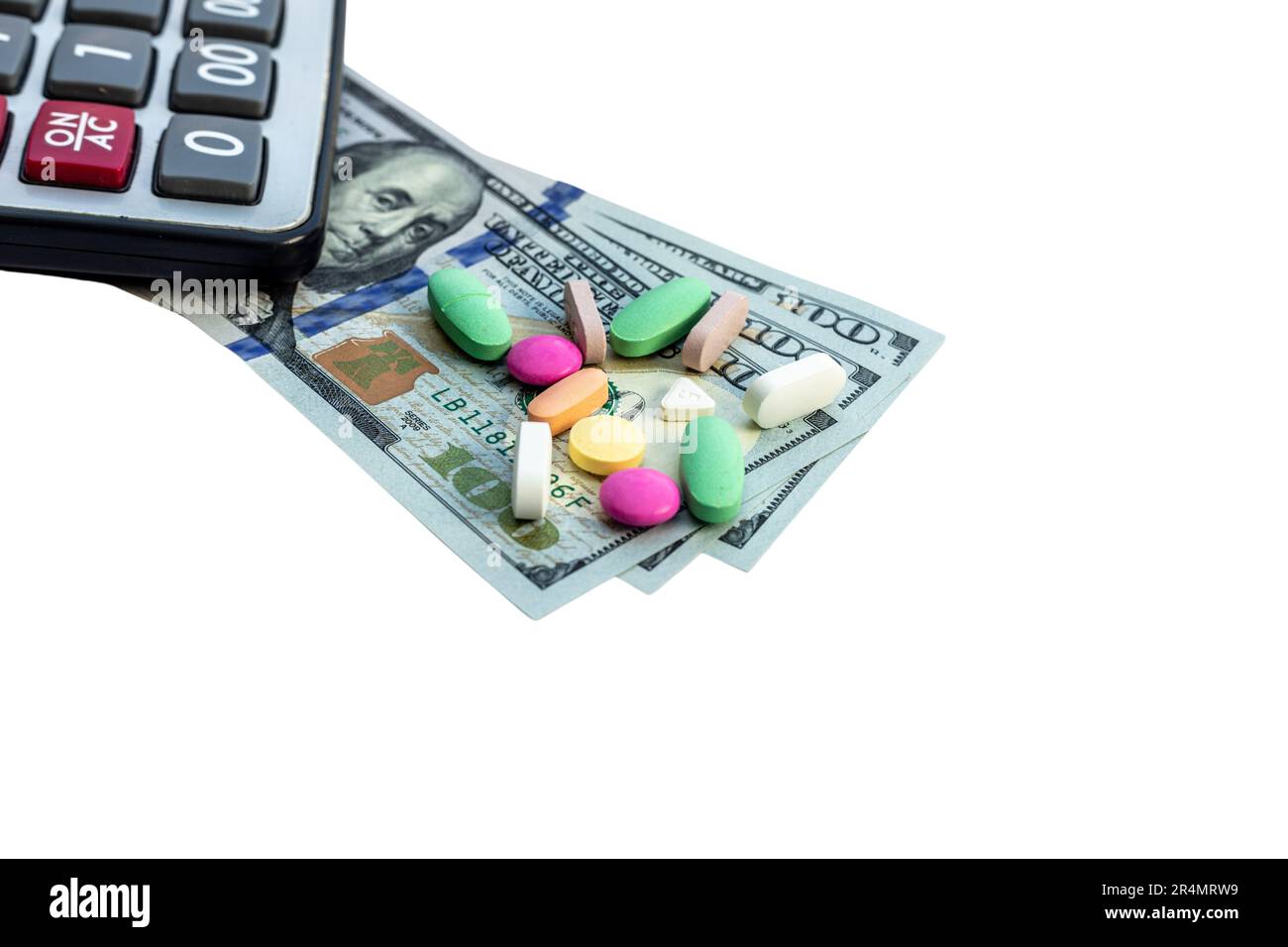 US dollars bills and medicine pills on white isolated background. High ...