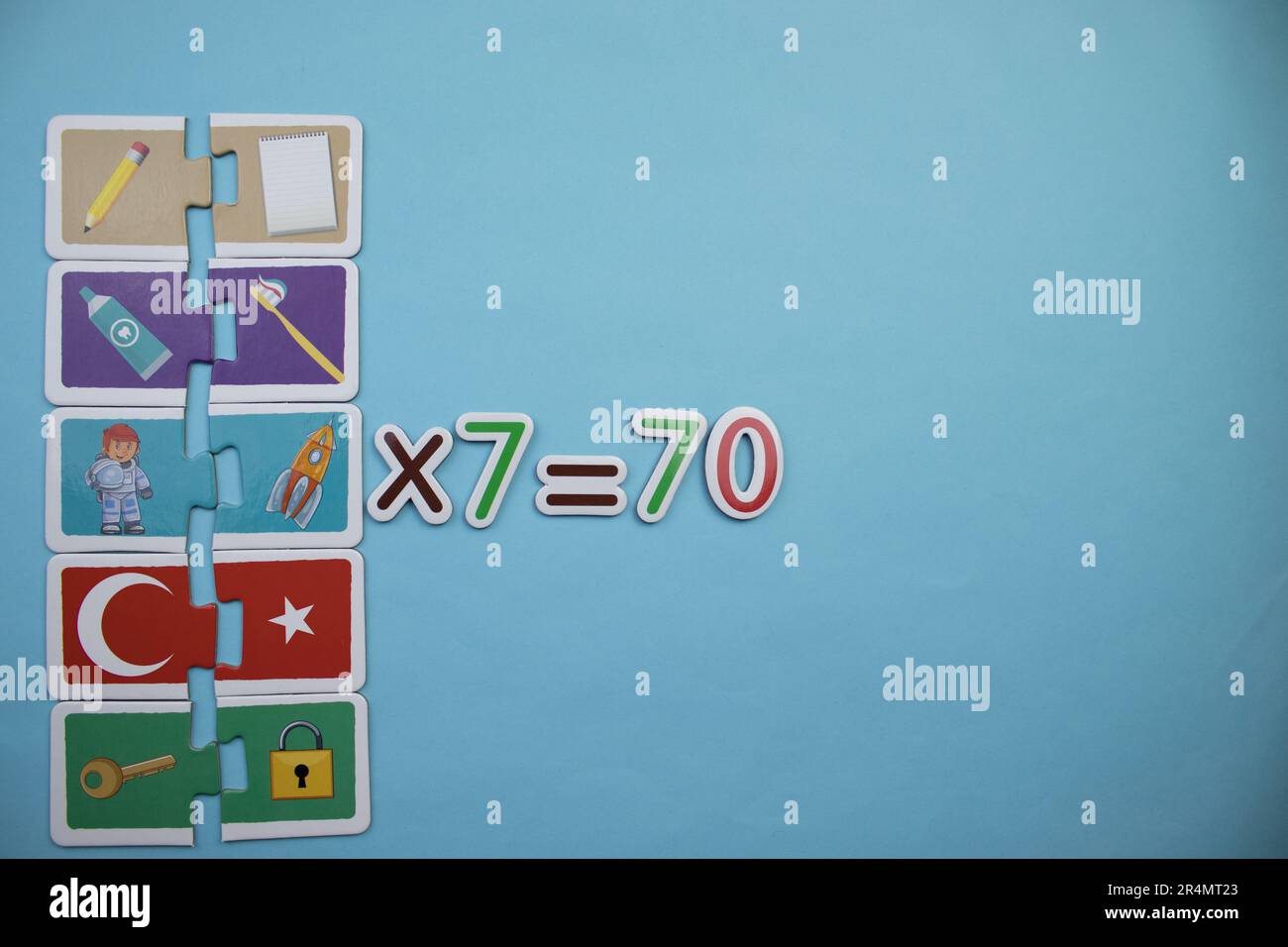 Ten jigsaw puzzles times seven equals seventy, photographed from above ...