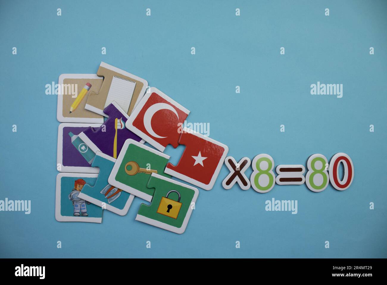 Ten jigsaw puzzles times eight equals eighty, photographed from above ...