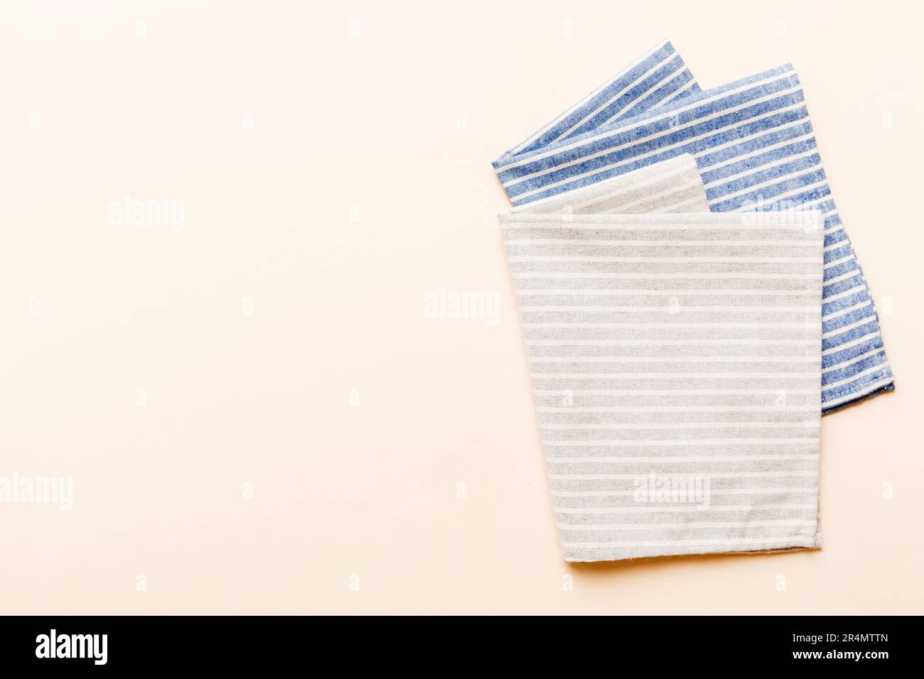 top view with gray kitchen napkin isolated on table background. Folded ...