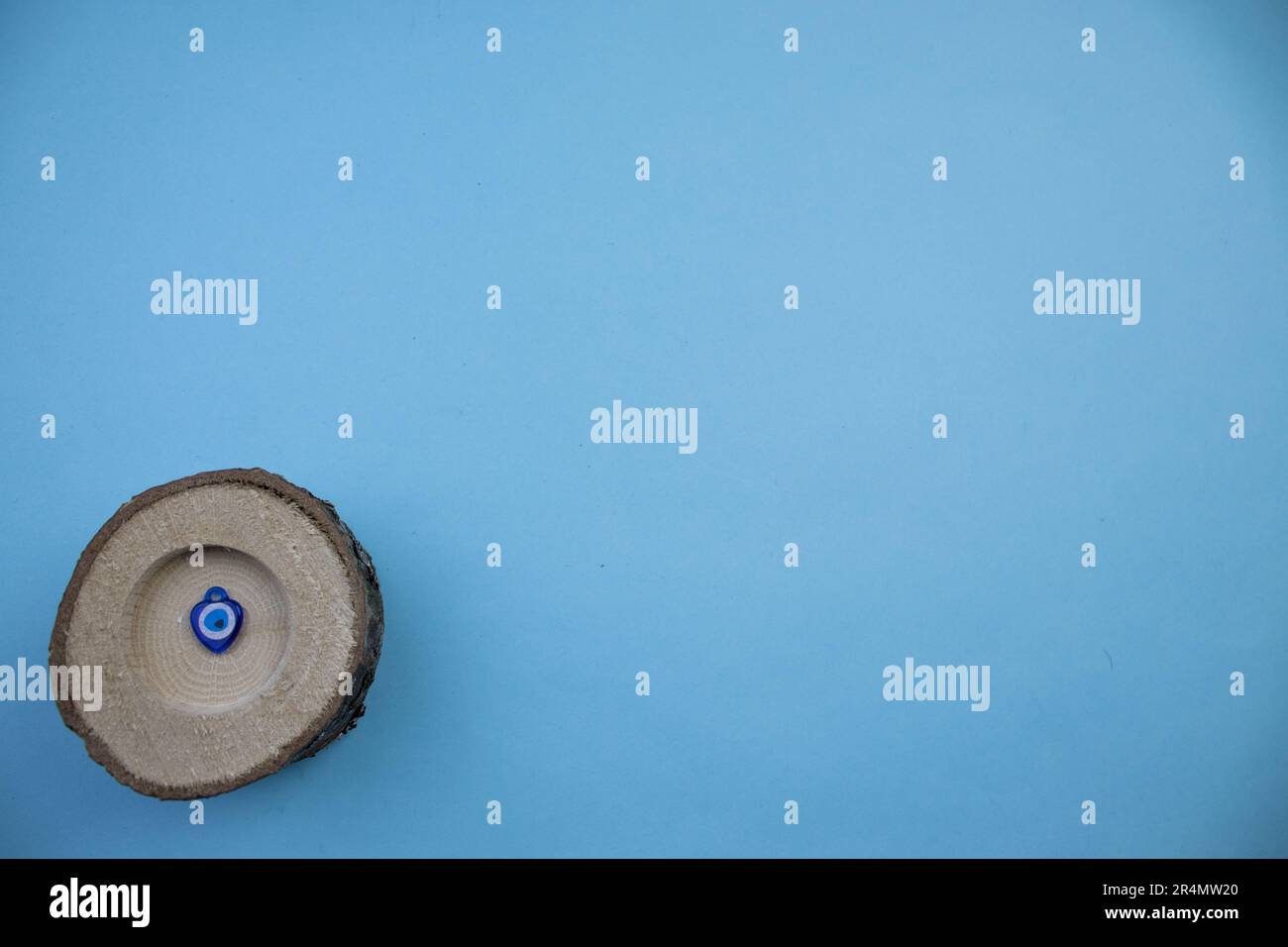 Small log photographed from above, placed on the edge of the blue ...
