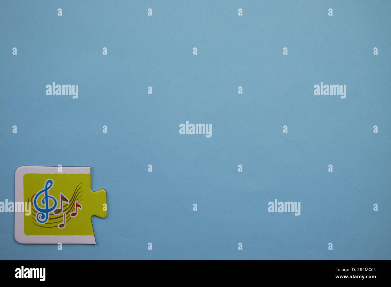 Picture puzzles placed on the edge of a blue background. Left key ...