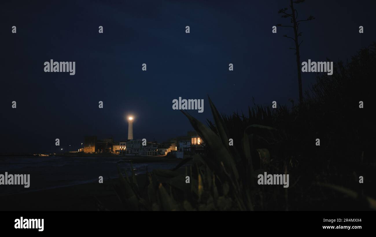 Light beam of the lighthouse in the night Stock Photo - Alamy