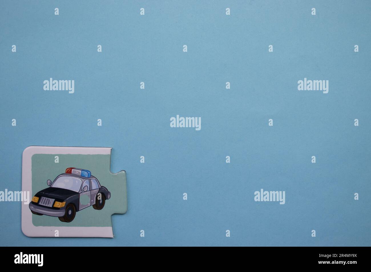 Picture puzzles placed on the edge of the blue background. Police car ...
