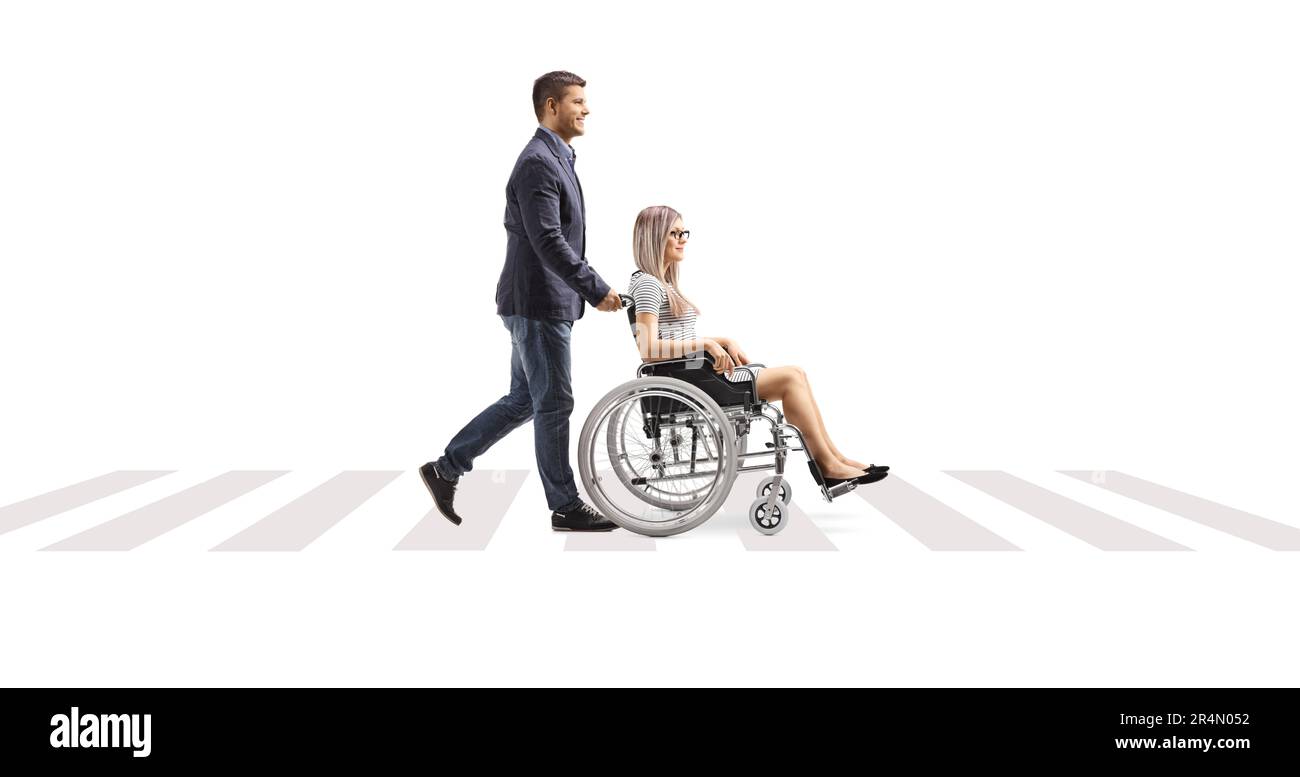 Full length profile shot of a young man pushing a young woman in a ...