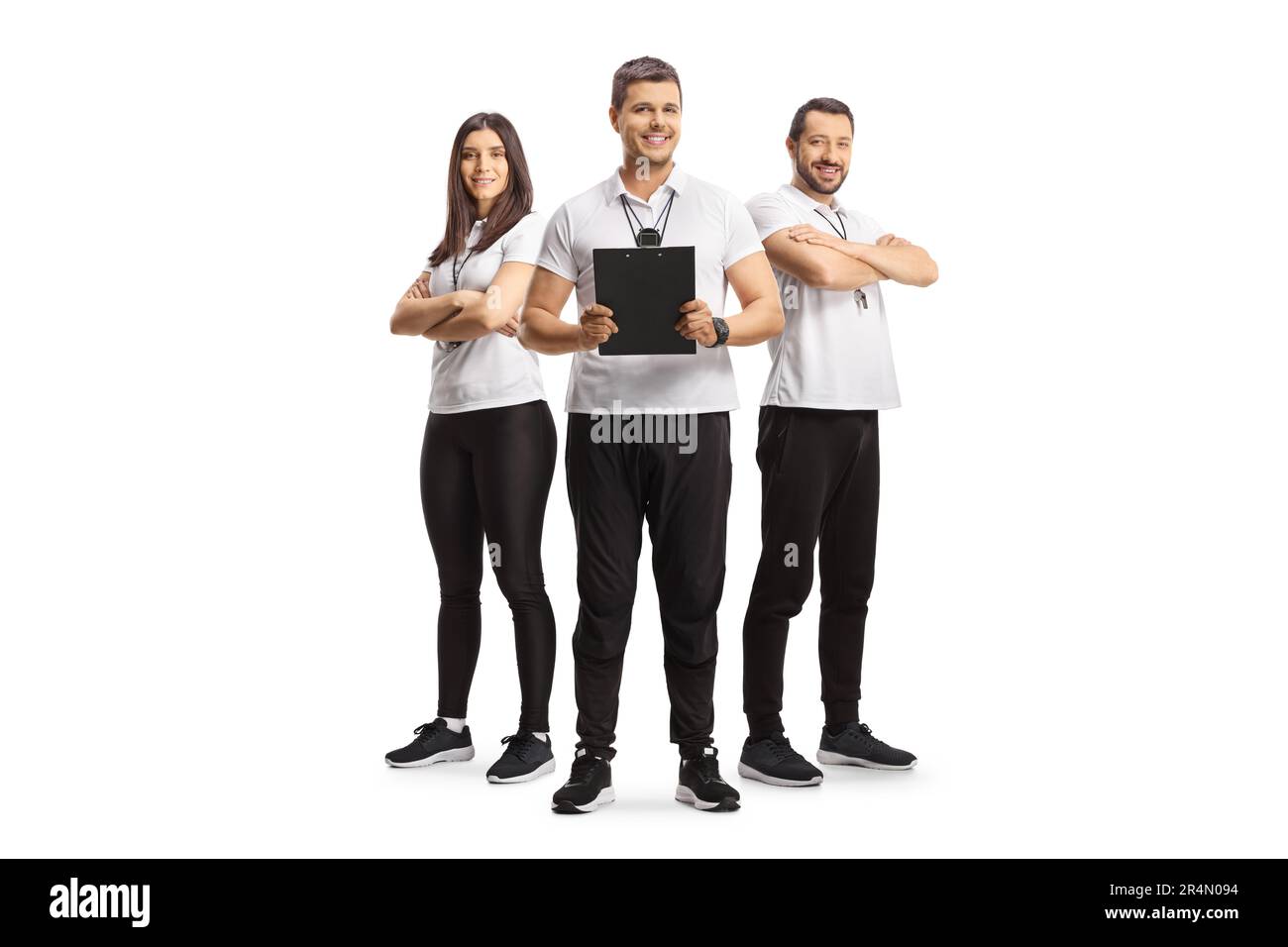 Team of sports coaches posing together isolated on white background ...