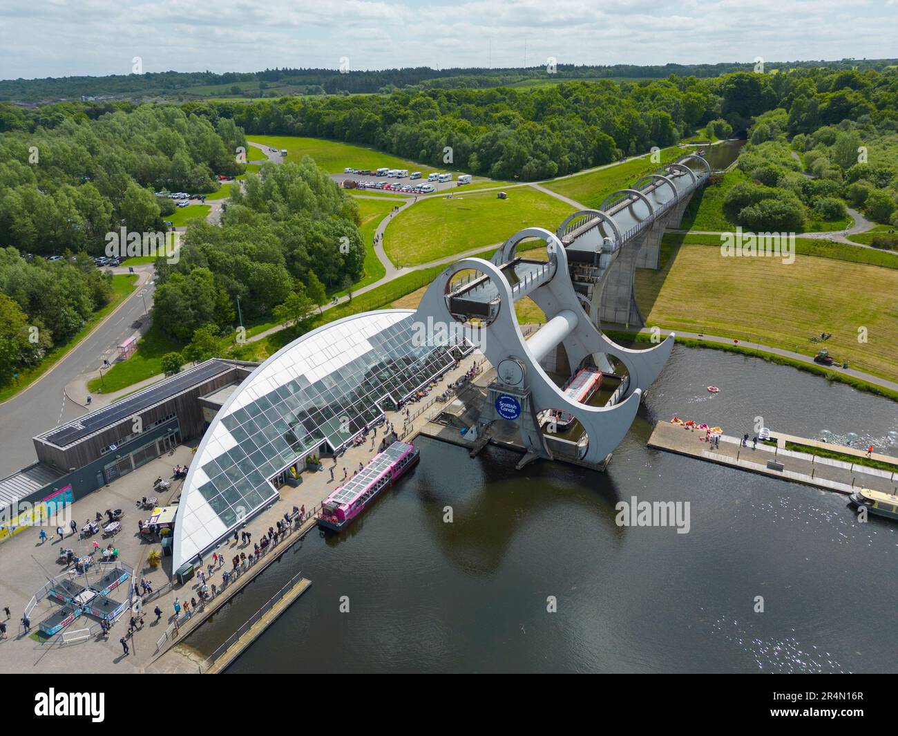 Aerial view from drone of Falkirk Wheel rotating boat lift on Forth and ...
