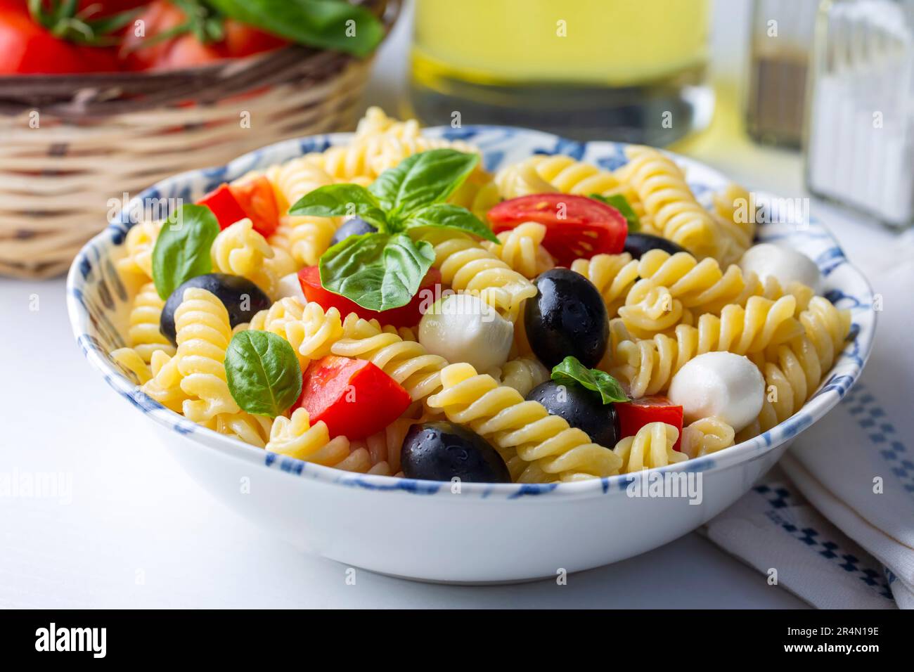 Italian cold pasta salad or Pasta fredda alla caprese. Directly above ...