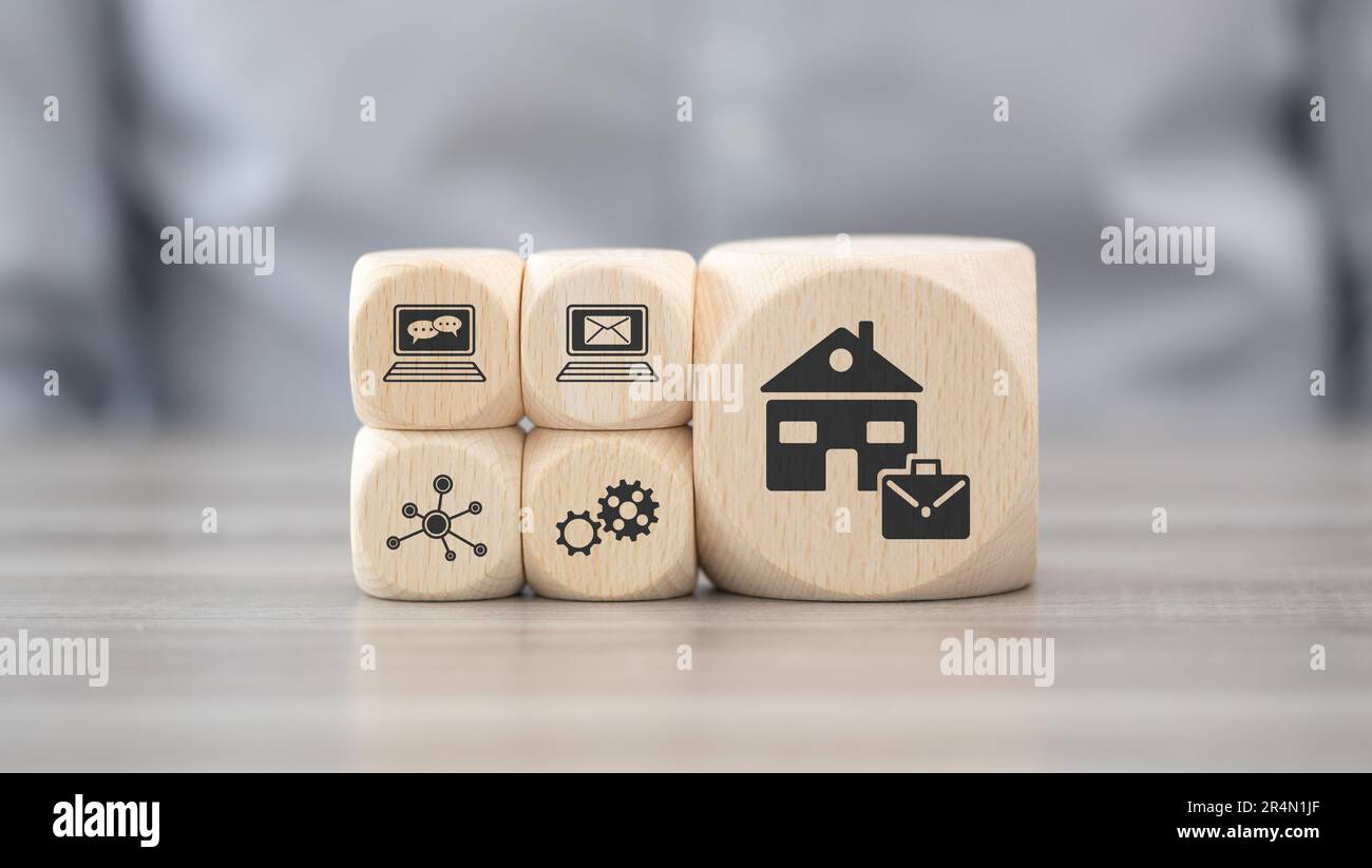 Wooden blocks with symbol of work from home concept Stock Photo - Alamy