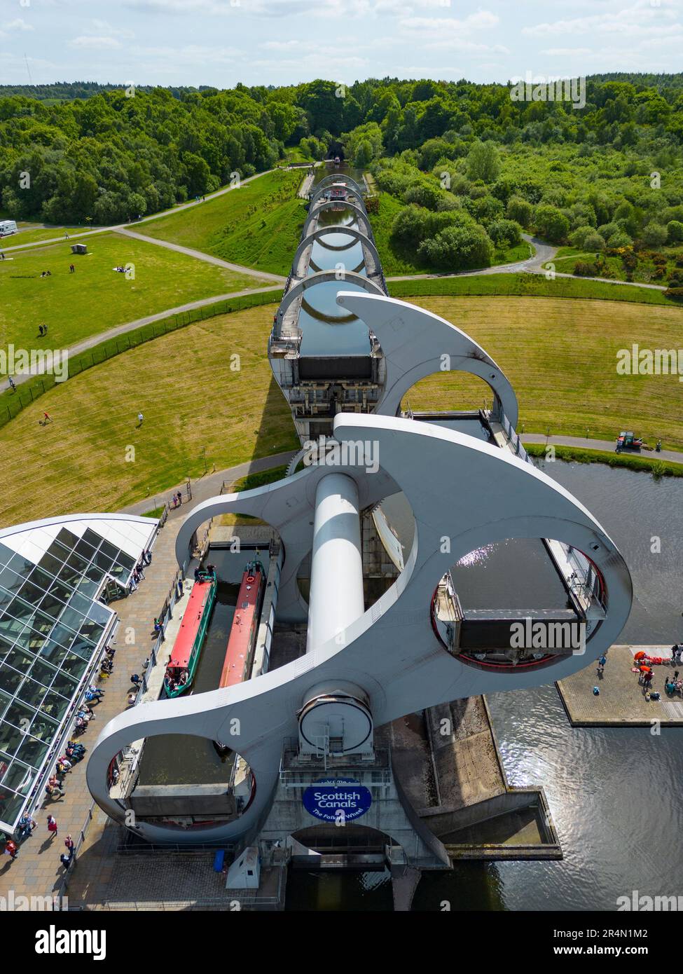 Aerial view from drone of Falkirk Wheel rotating boat lift on Forth and ...