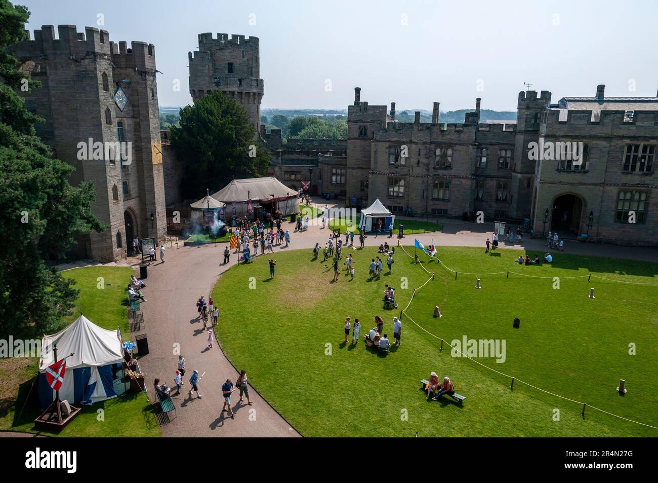 Visitors wondering around the central courtyard at the 12th century ...