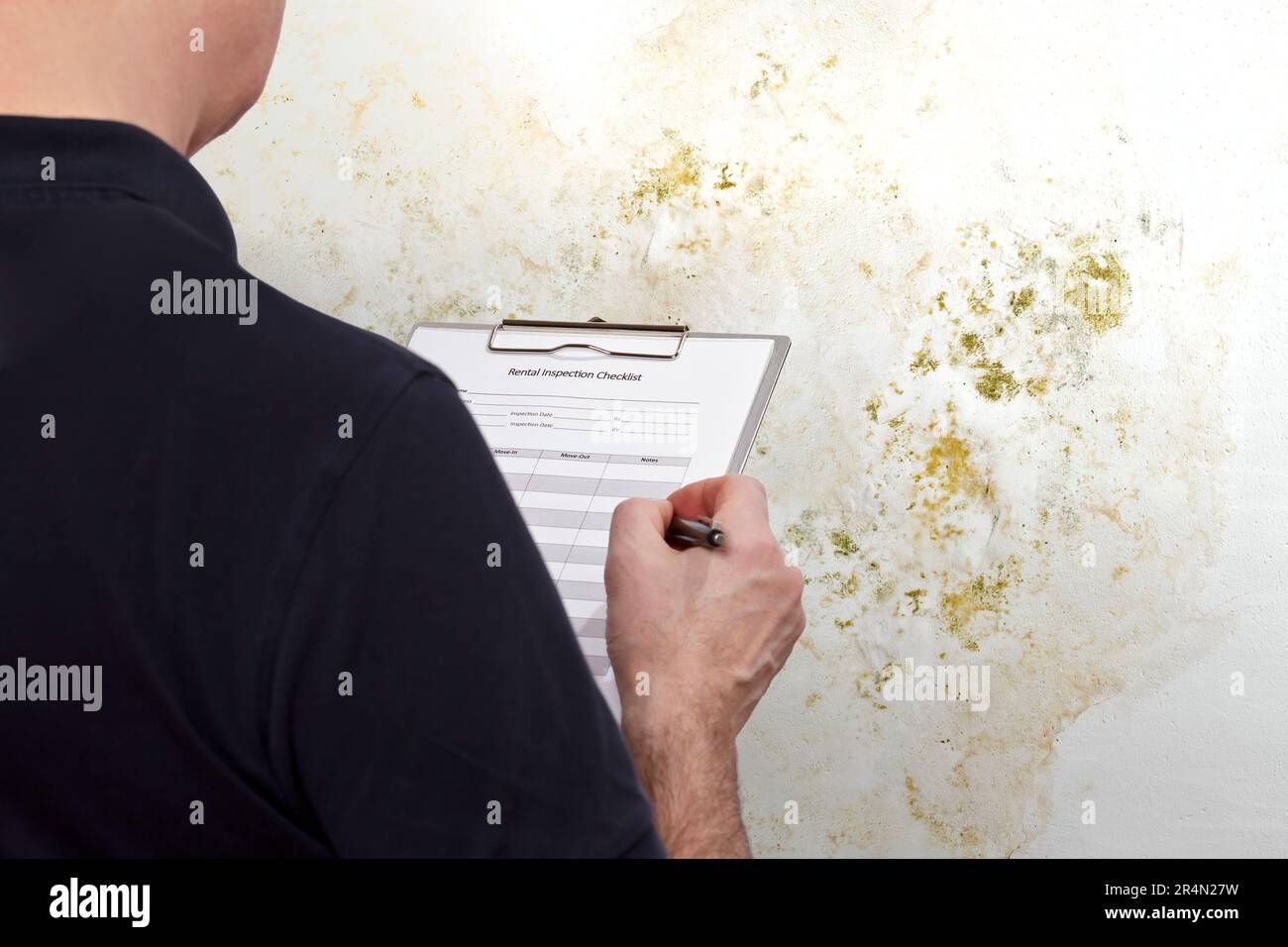 High humidity damage concept: man with an inspection checklist in front ...