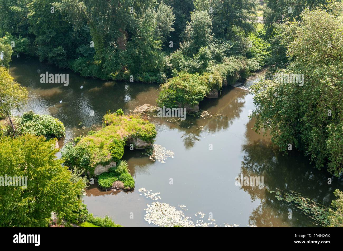 The ruins of the medieval bridge built in 1374 across the River Avon in ...