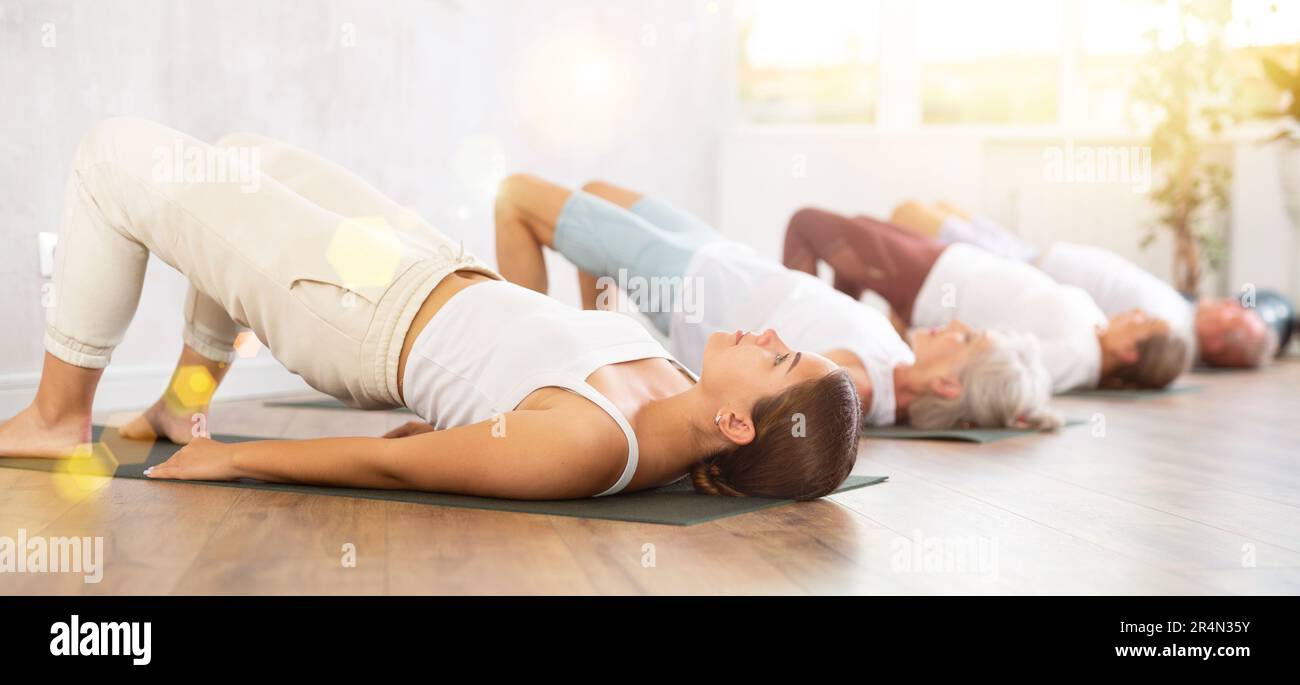 Women making yoga exercises hi-res stock photography and images - Alamy