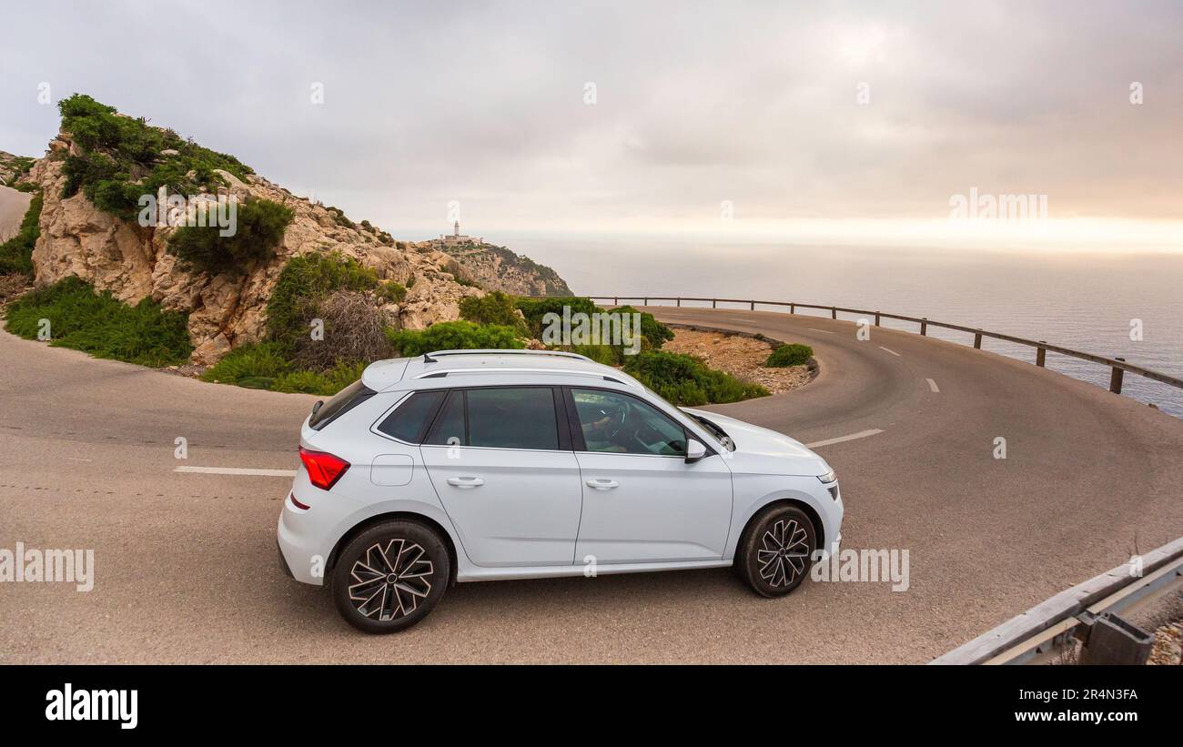Car on the curve with a view of sea and mountain Stock Photo - Alamy