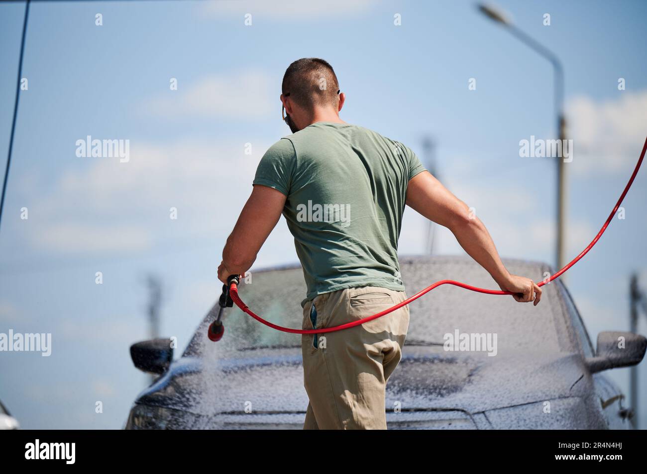 Man using water gun hi-res stock photography and images - Alamy