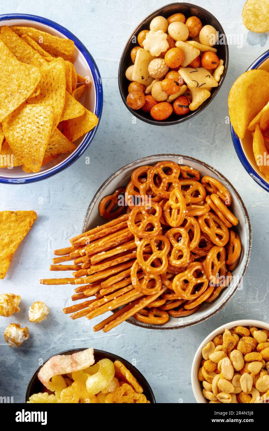 Salty snacks, party mix. An assortment of appetizers, shot from above ...