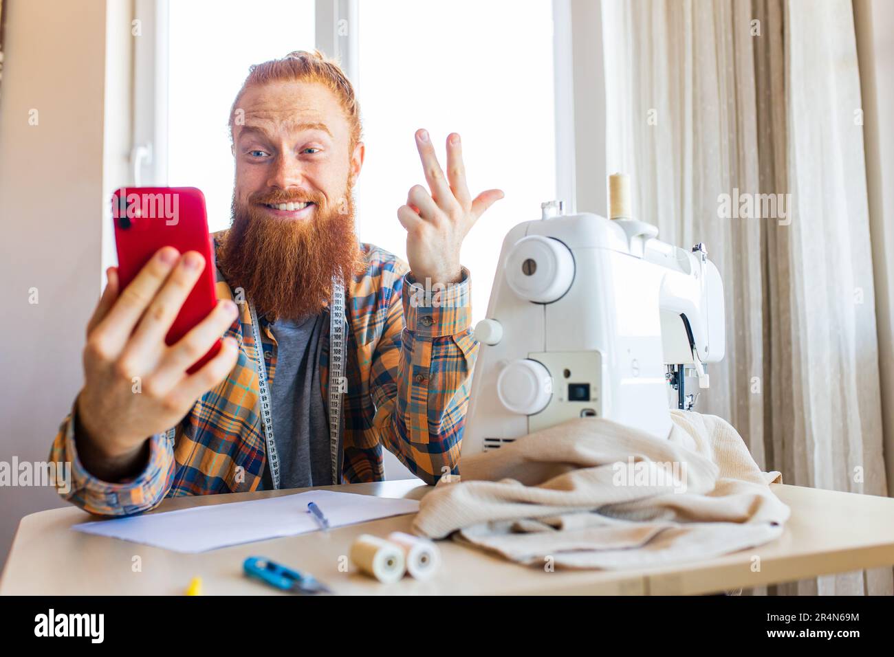 Man sews sewing machine designer hi-res stock photography and images ...