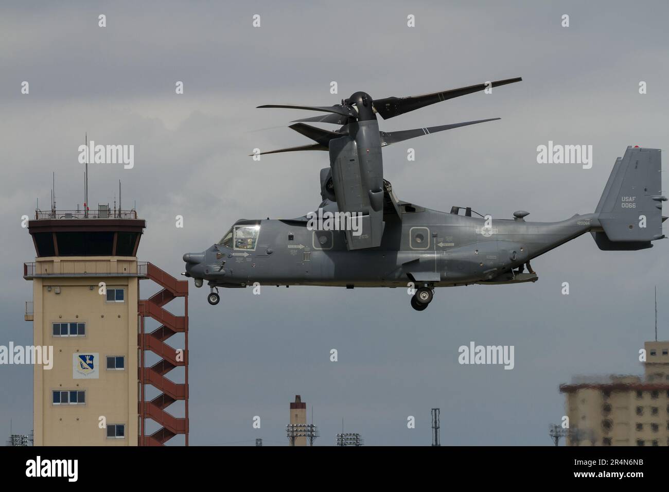 A USAF Bell Boeing V22 Osprey flying in front of the air-traffic ...