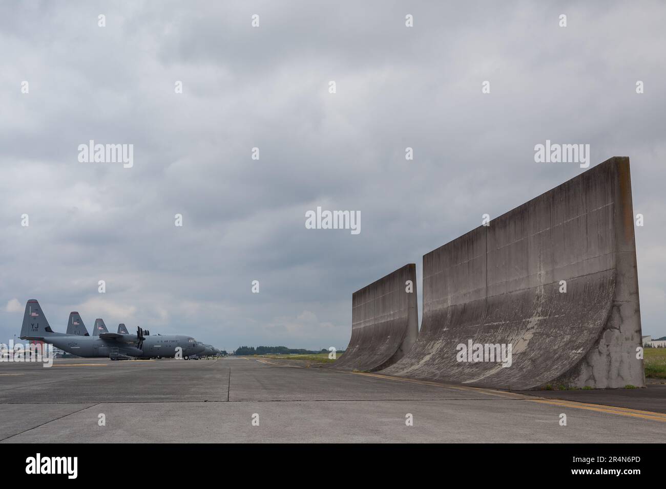 A line of USAF Lockheed Martin C130-J Hercules aircraft behind jet ...
