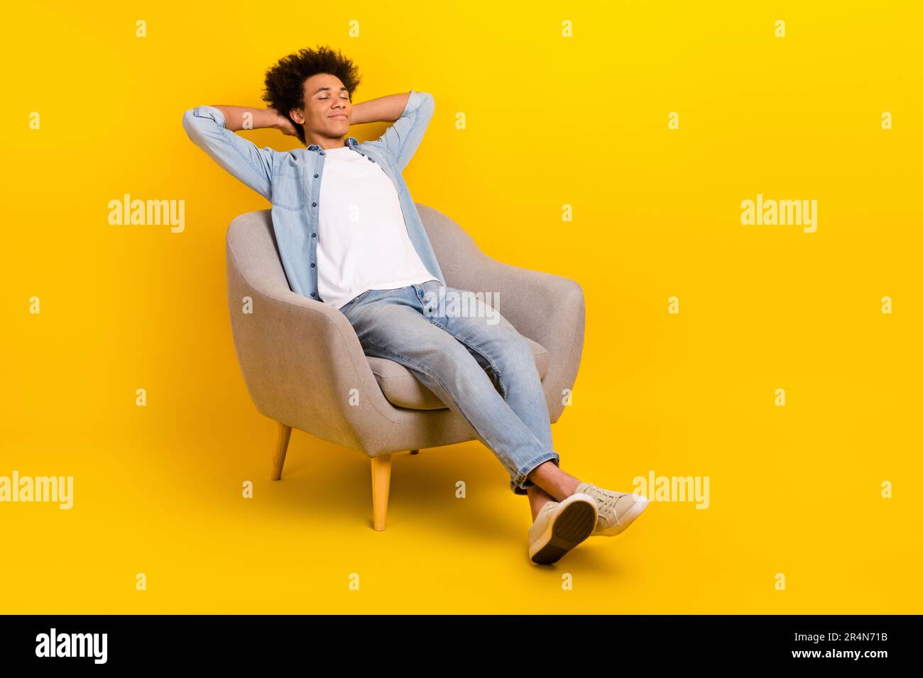Full length photo of satisfied young person sit comfy chair closed eyes ...
