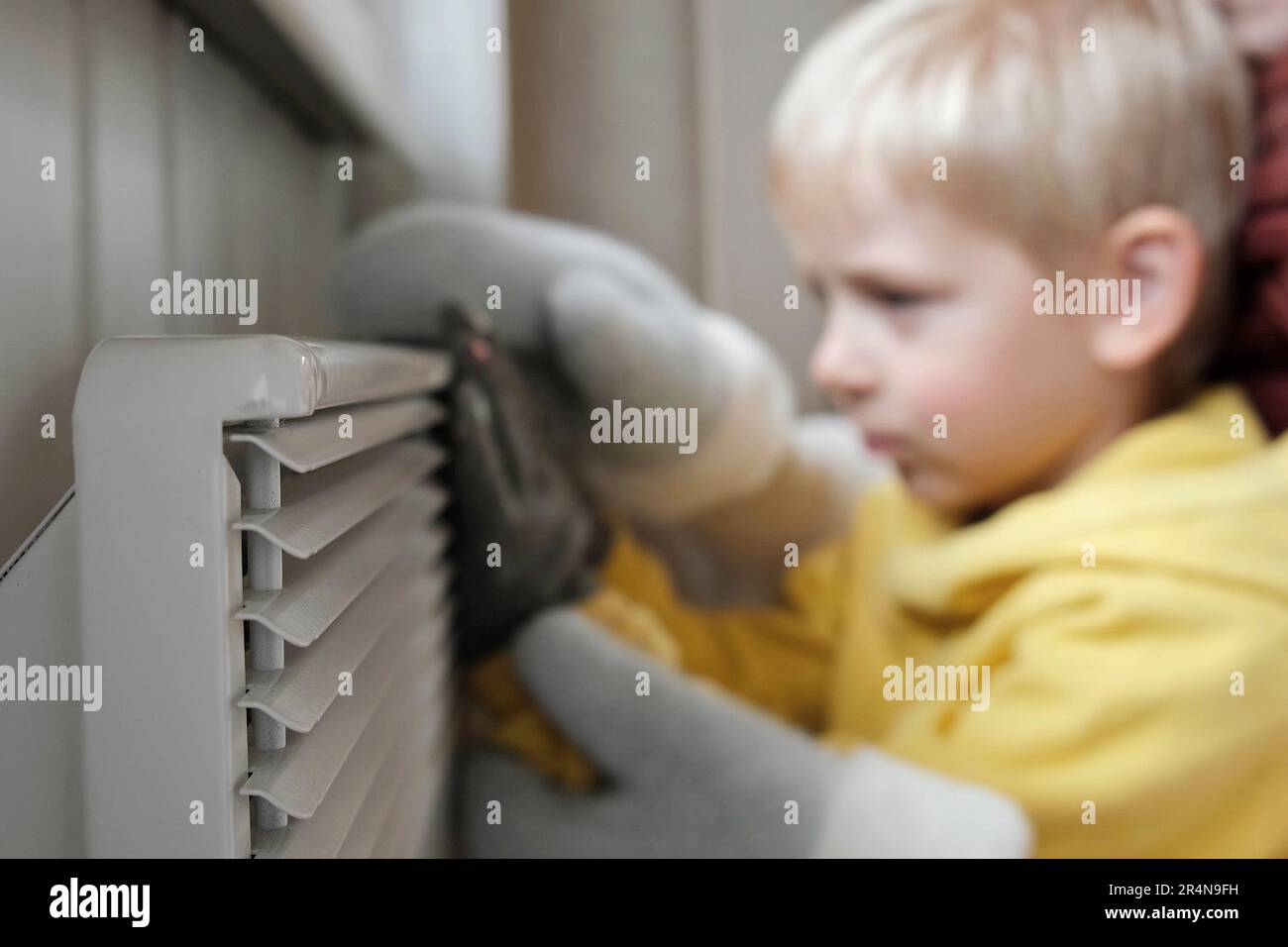 Frozen Mother and Son wearing sweaters shaking and freezing for winter ...