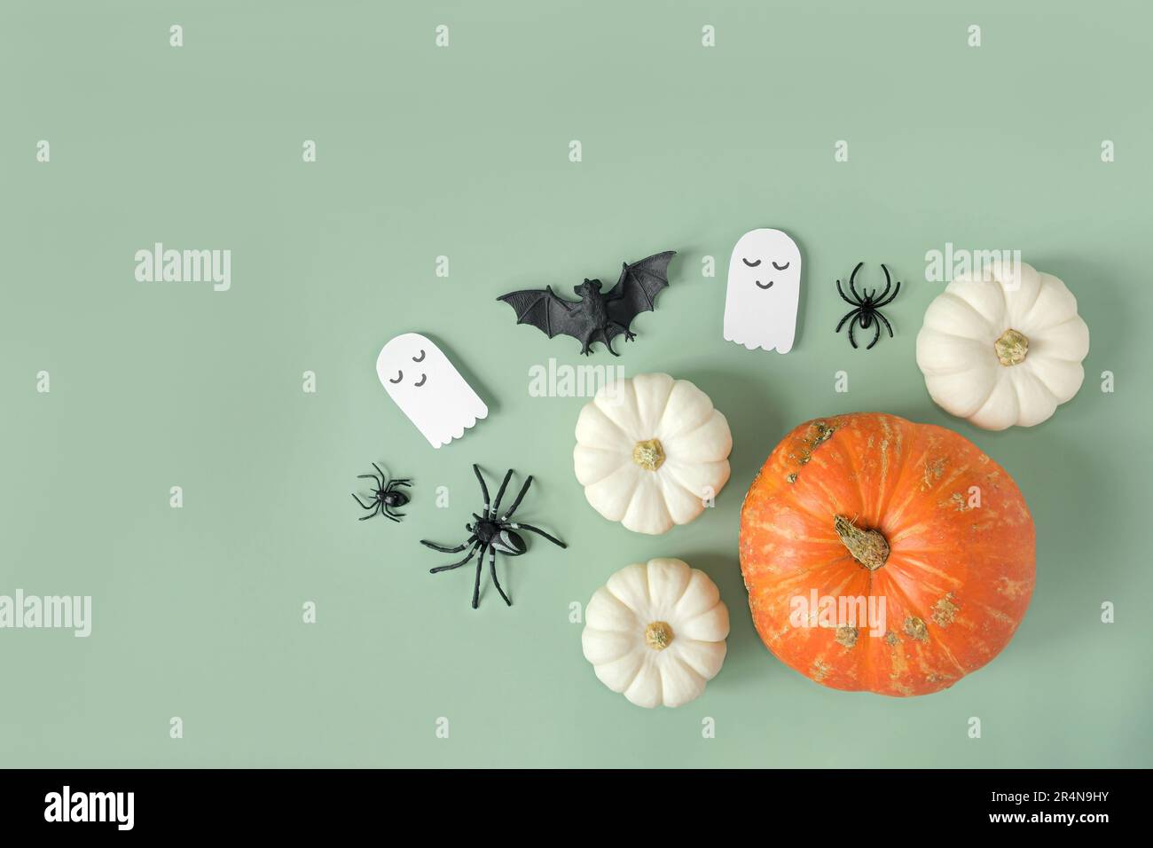 Halloween background with black bats, spiders, orange pumpkins. Modern ...
