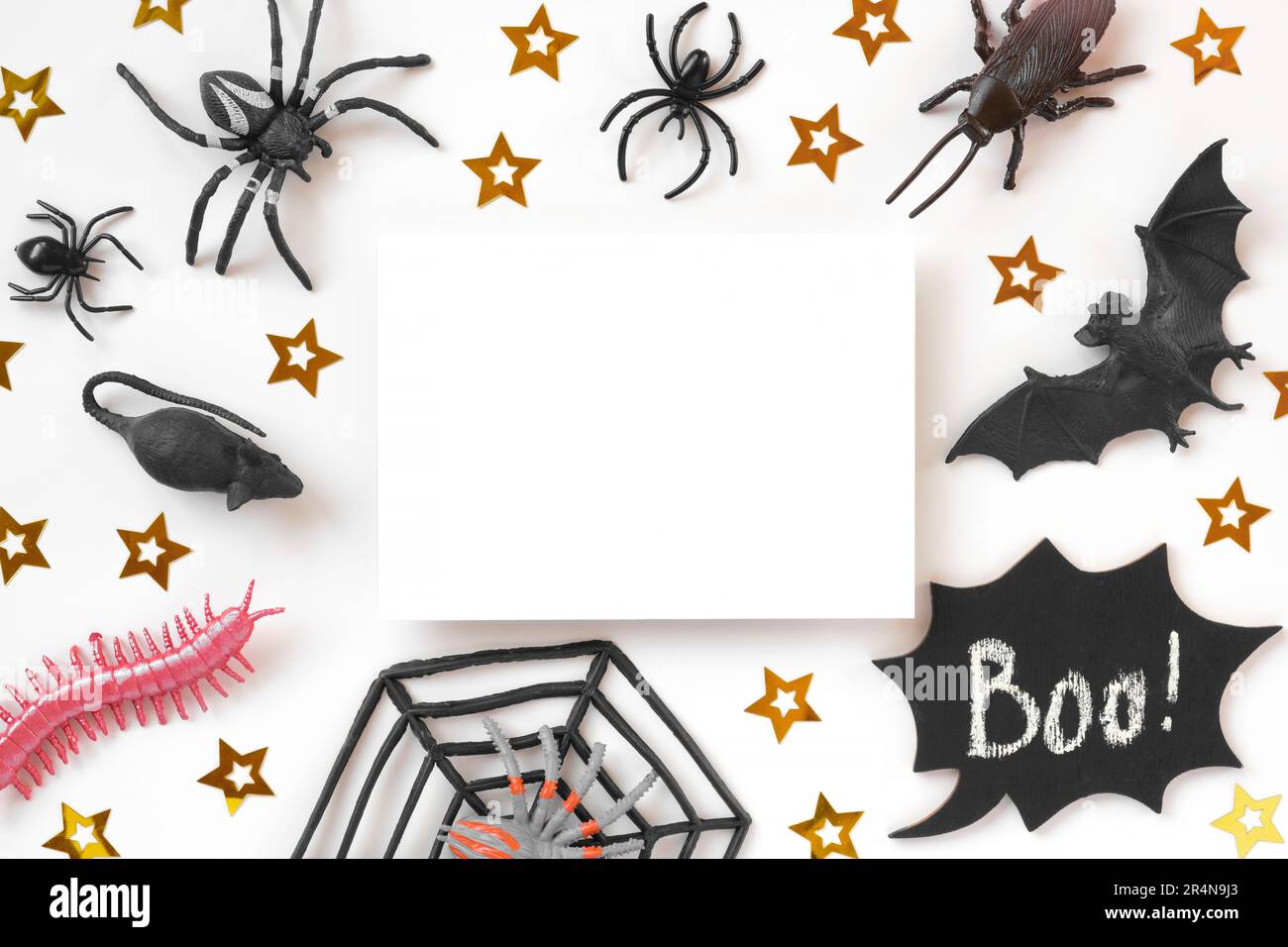White paper sheet on Halloween background with black bats, spiders and ...