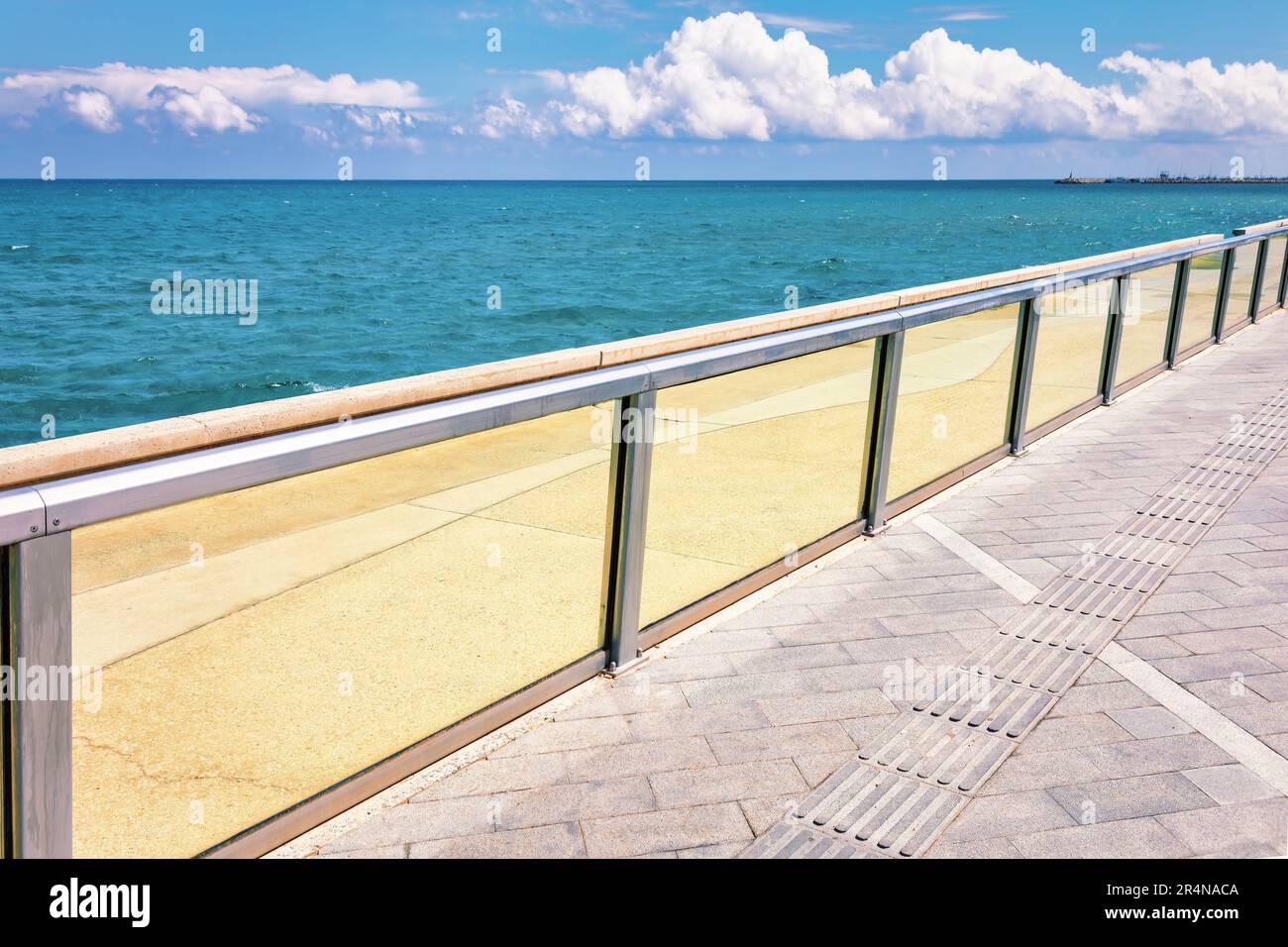Seaside with glass balustrade . Sidewalk on the sea shore Stock Photo ...