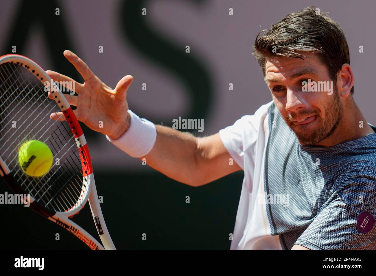 Britain's Cameron Norrie plays a shot against France's Benoit Paire ...