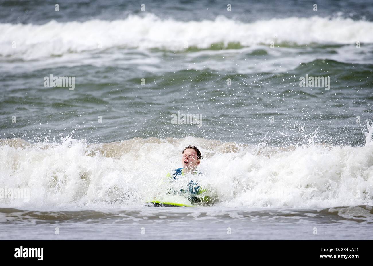 BLOEMENDAAL AAN ZEE - Day trippers on the beach on Whit Monday. Many ...
