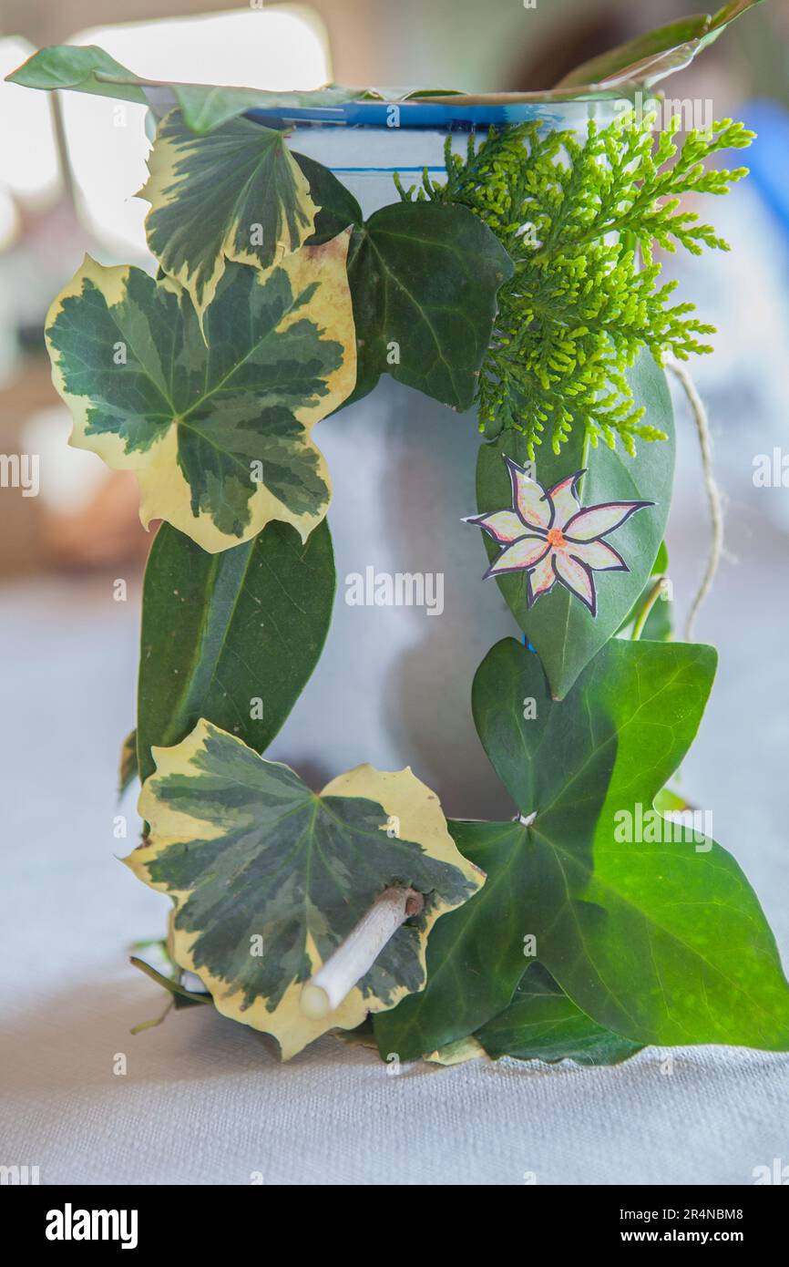 Bird feeder made with recycled materials. Crafts made by children in a ...