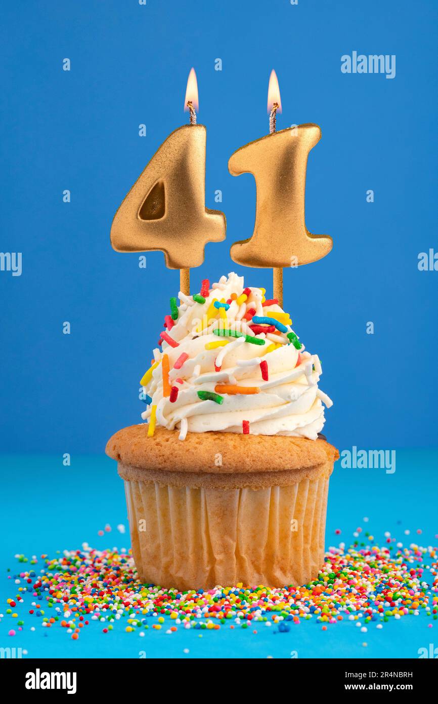 Candle number 41 - Cake birthday in blue background Stock Photo - Alamy