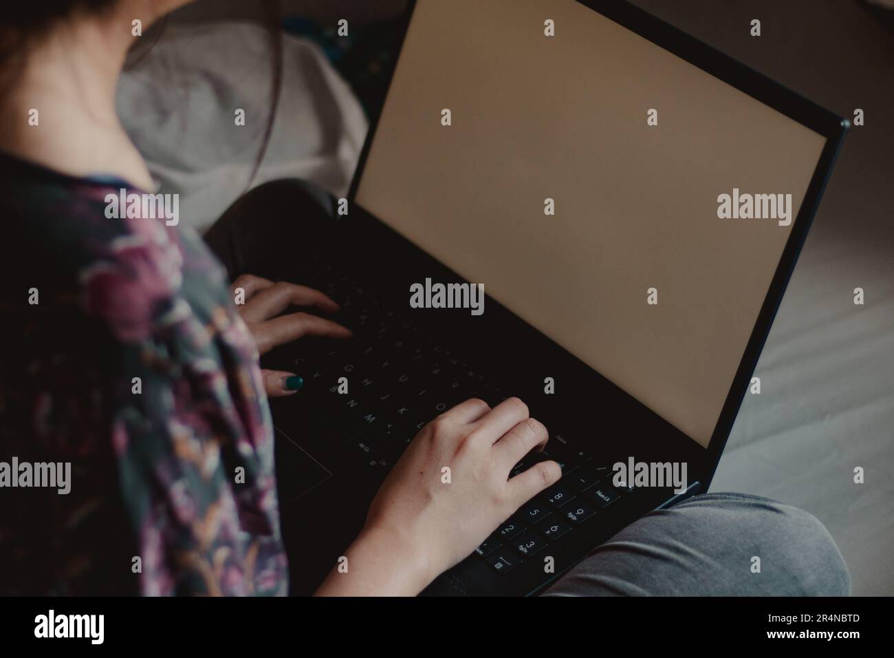 Woman Taking Notes on a Laptop Stock Photo - Alamy