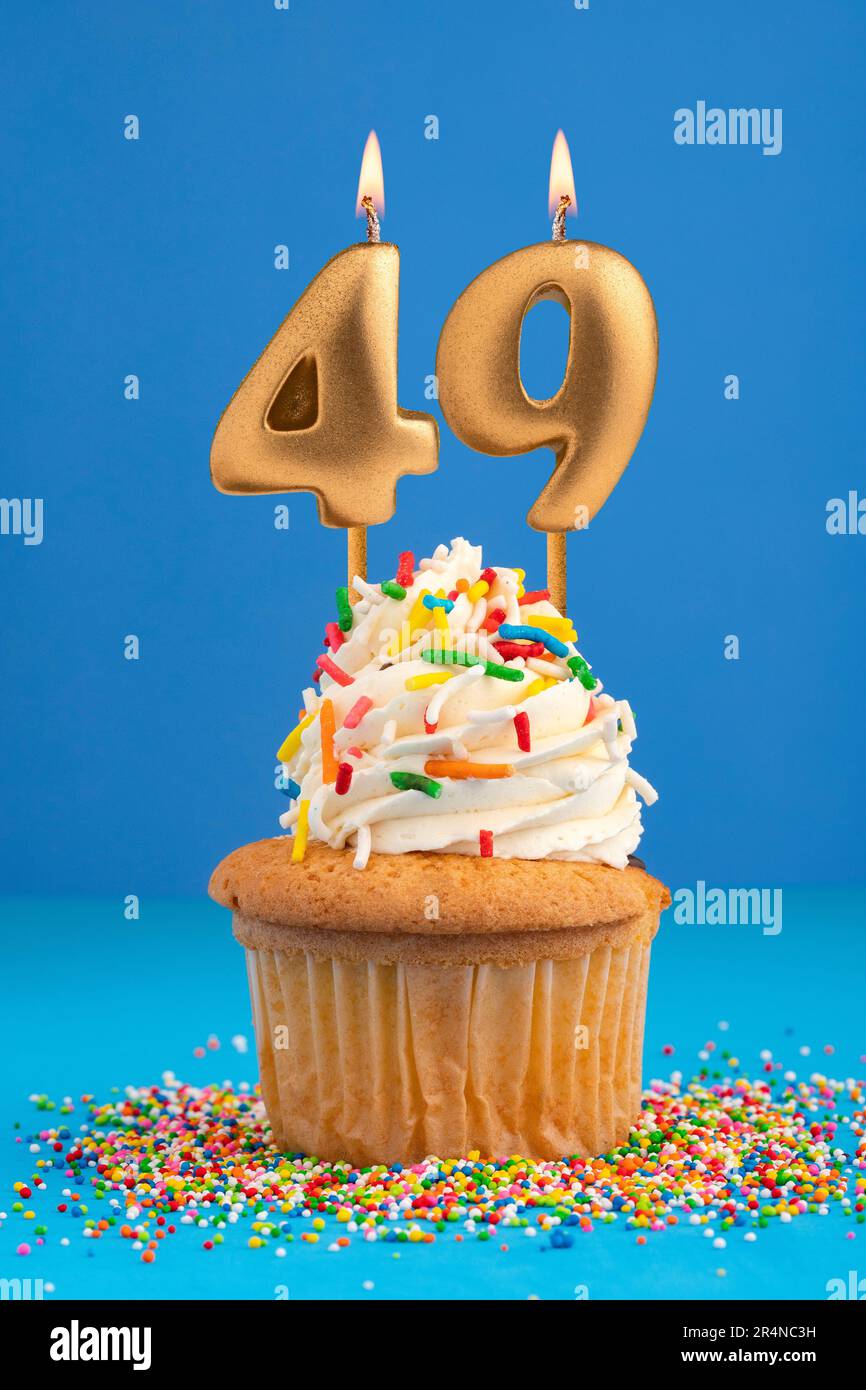 Candle number 49 - Cake birthday in blue background Stock Photo - Alamy