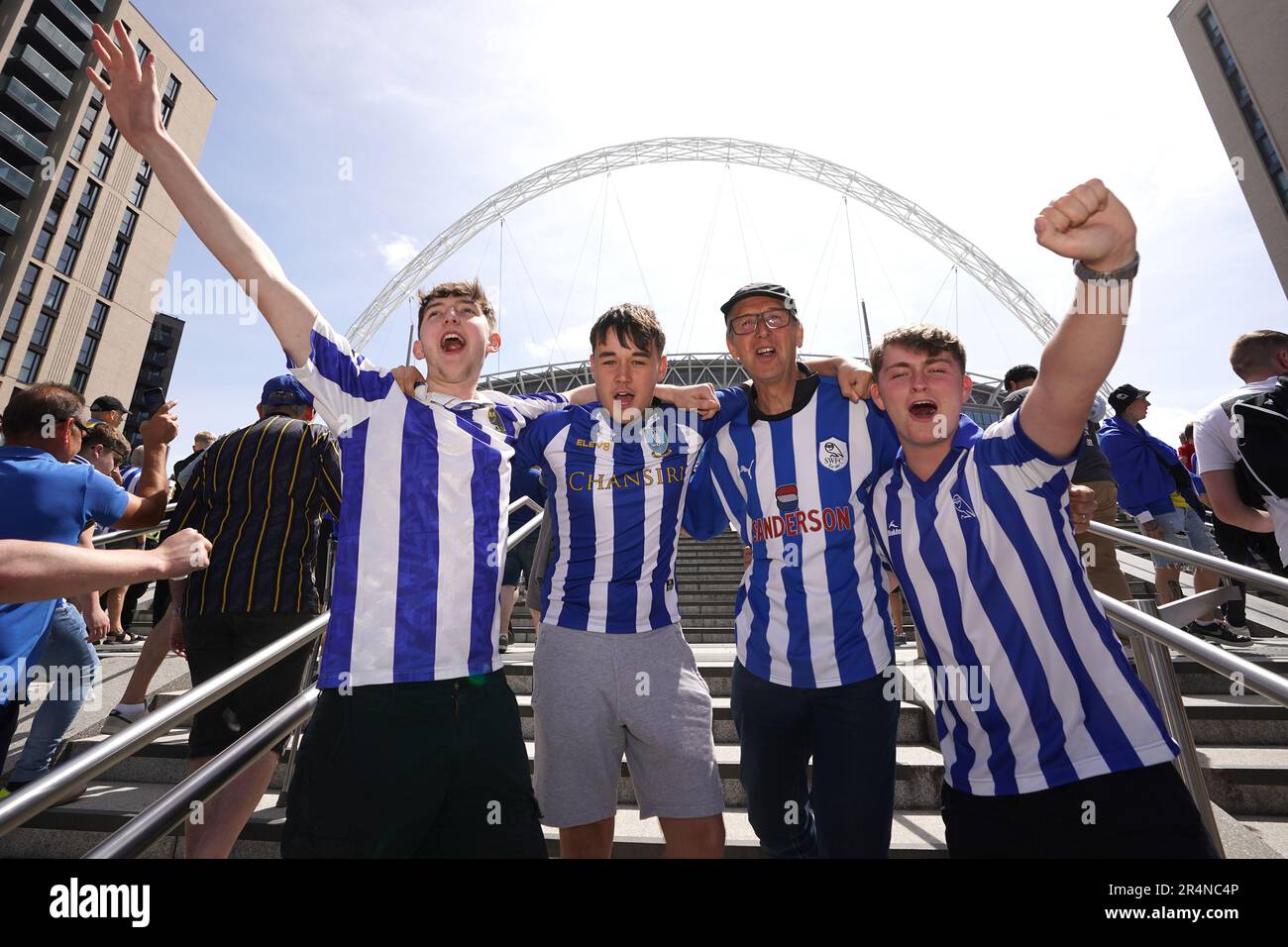 Sheffield Wednesday fan Isaac Parkin (right) and fans pose for ...