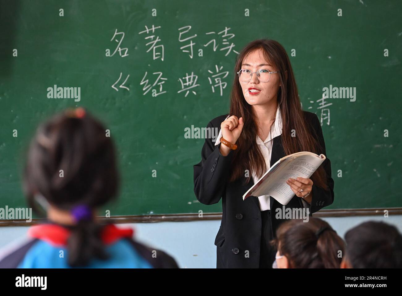 Urumqi, China's Xinjiang Uygur Autonomous Region. 19th Apr, 2023. Aynagul Bagjuli teaches ...