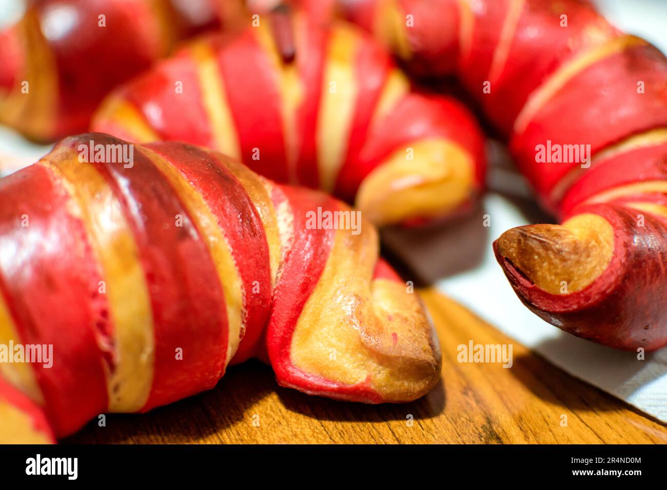 Freshly made Croissants and Cornettos pastries exposed on white cloth ...