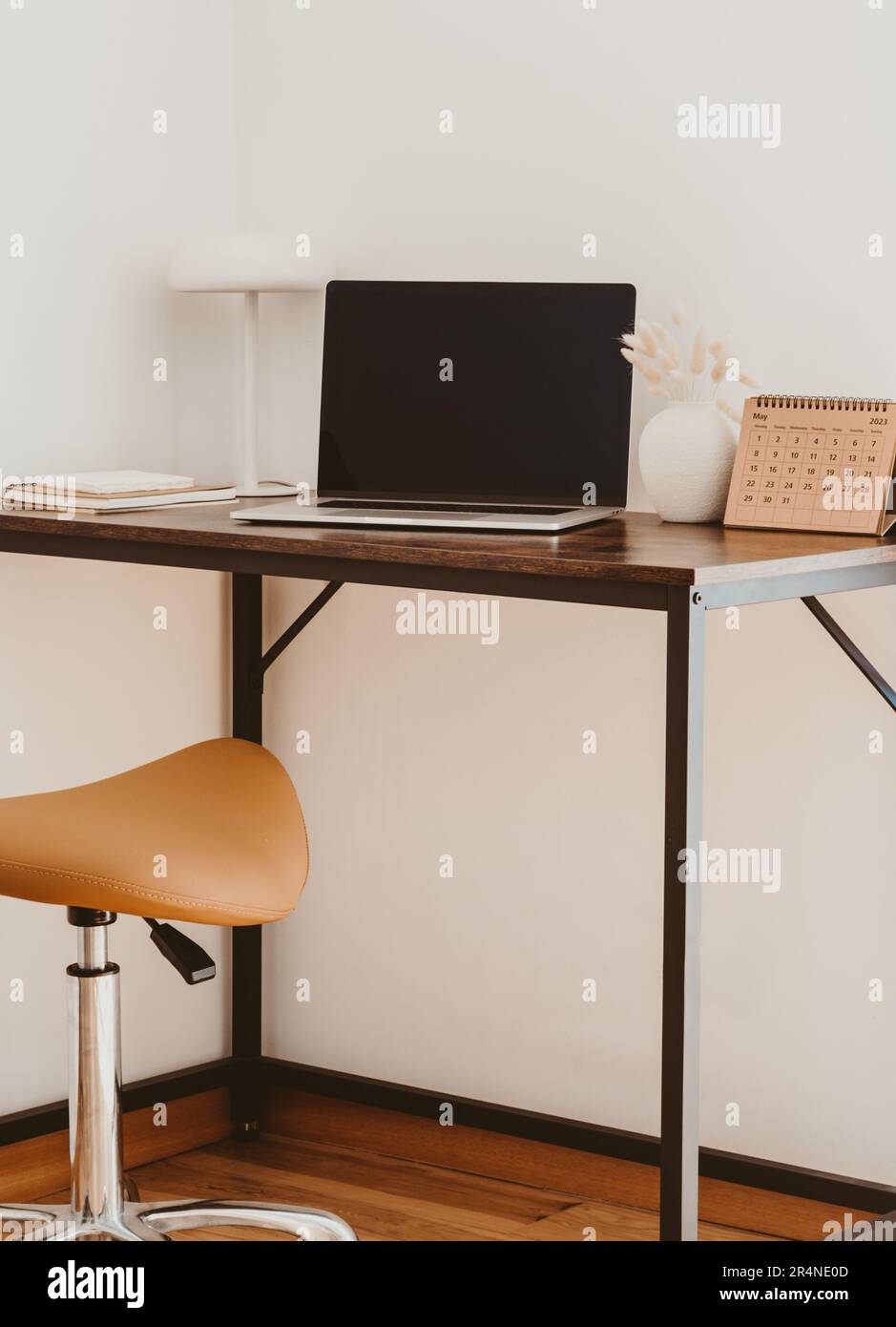 Stylish home office interior with laptop screen mockup, wooden table ...