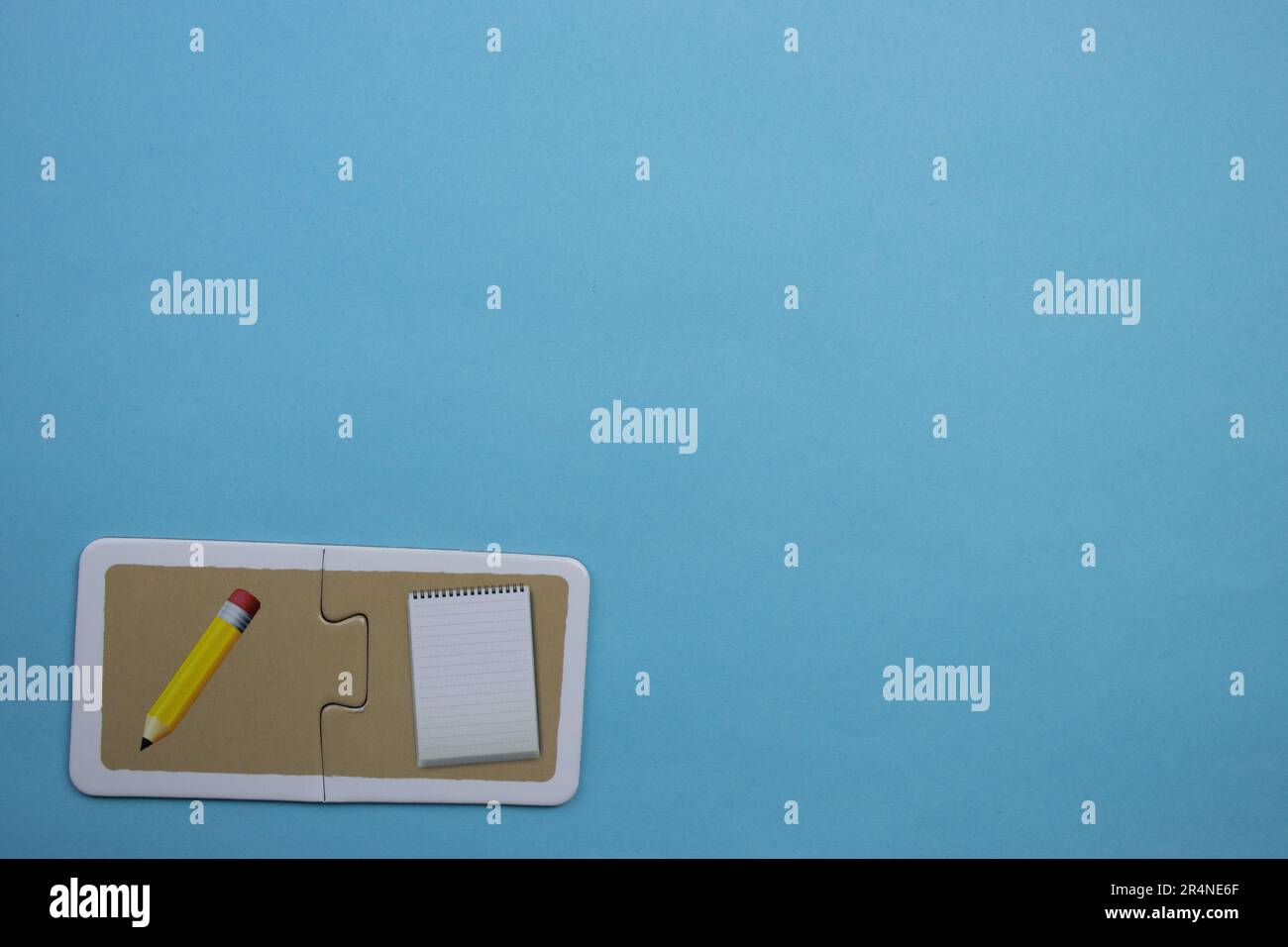 Picture puzzles placed on the edge of the blue background. Pen and ...