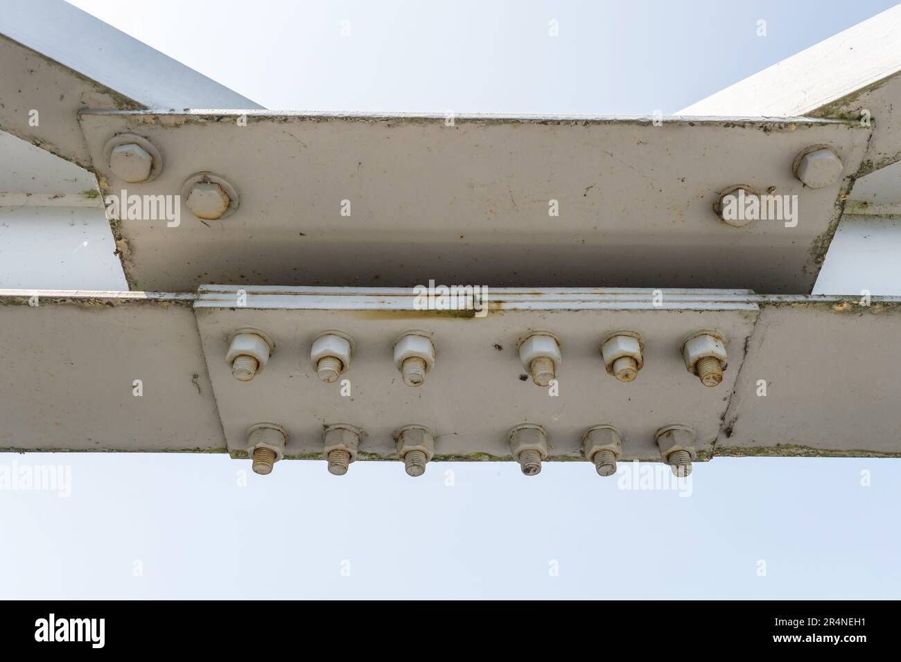 Bolts and nuts on metal plates of steel structure of heavy duty ...